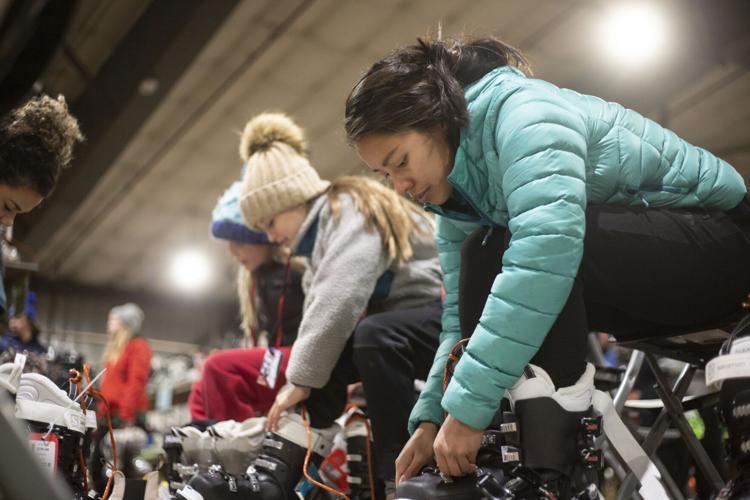 Skids and deal-chasers arrive before dawn at Ski & Gear Swap | The Hole ...