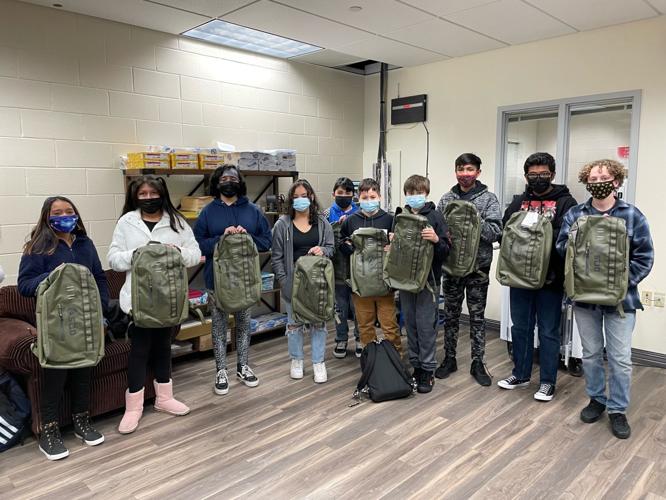 Stio gives backpacks to school children | Local | jhnewsandguide.com