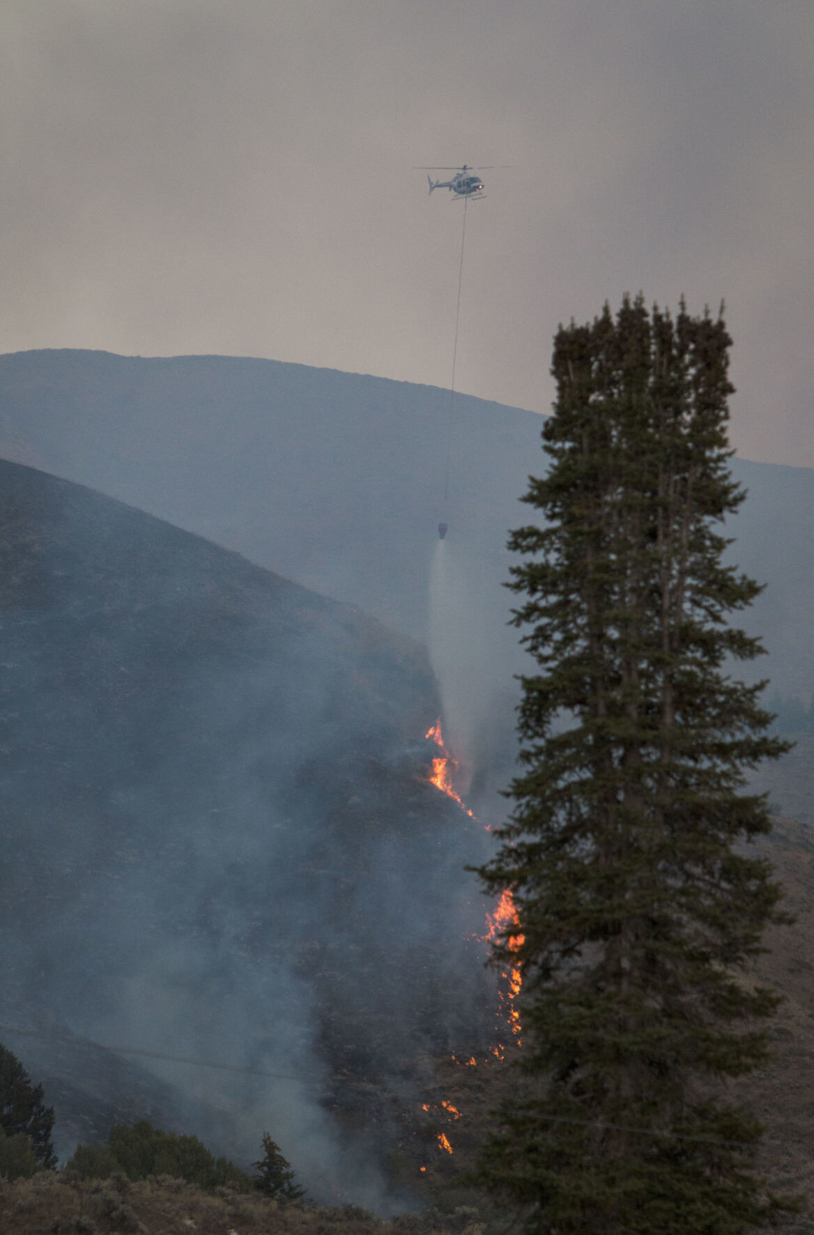 Firefight and a turn in the weather snuff out Swinging Bridge Fire ...