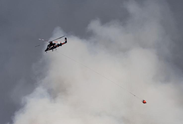 Firefighters wrapping homes, laying hose to protect Gros Ventre from ...