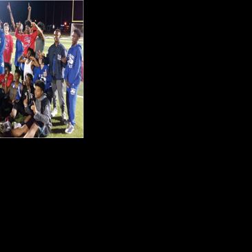The Marion Junior High track team celebrates it’s 6A-East district ...