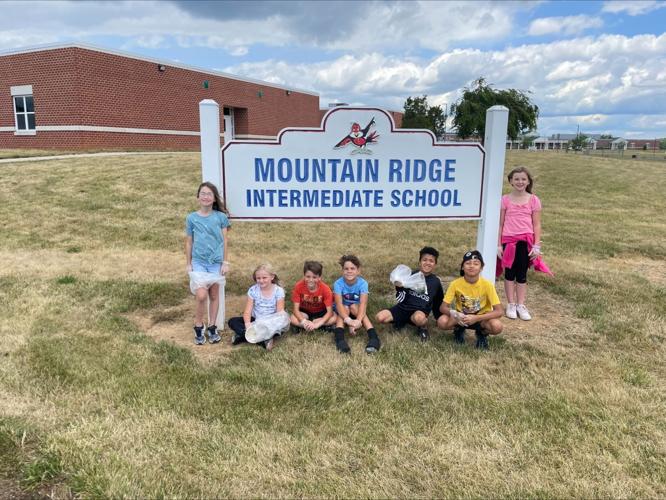 Students clean up campus around Mountain Ridge Intermediate as part of ...