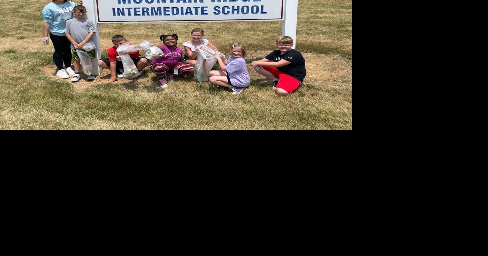 Students clean up campus around Mountain Ridge Intermediate as part of ...