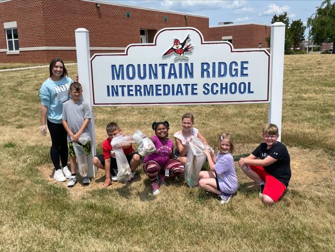 Students clean up campus around Mountain Ridge Intermediate as part of ...