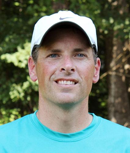 Reagan tennis coach Scott Larson