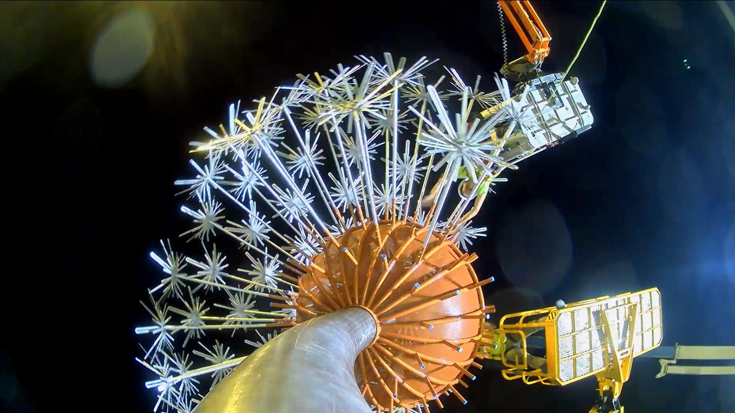 See photos of workers installing Winston-Salem's dandelion art project ...