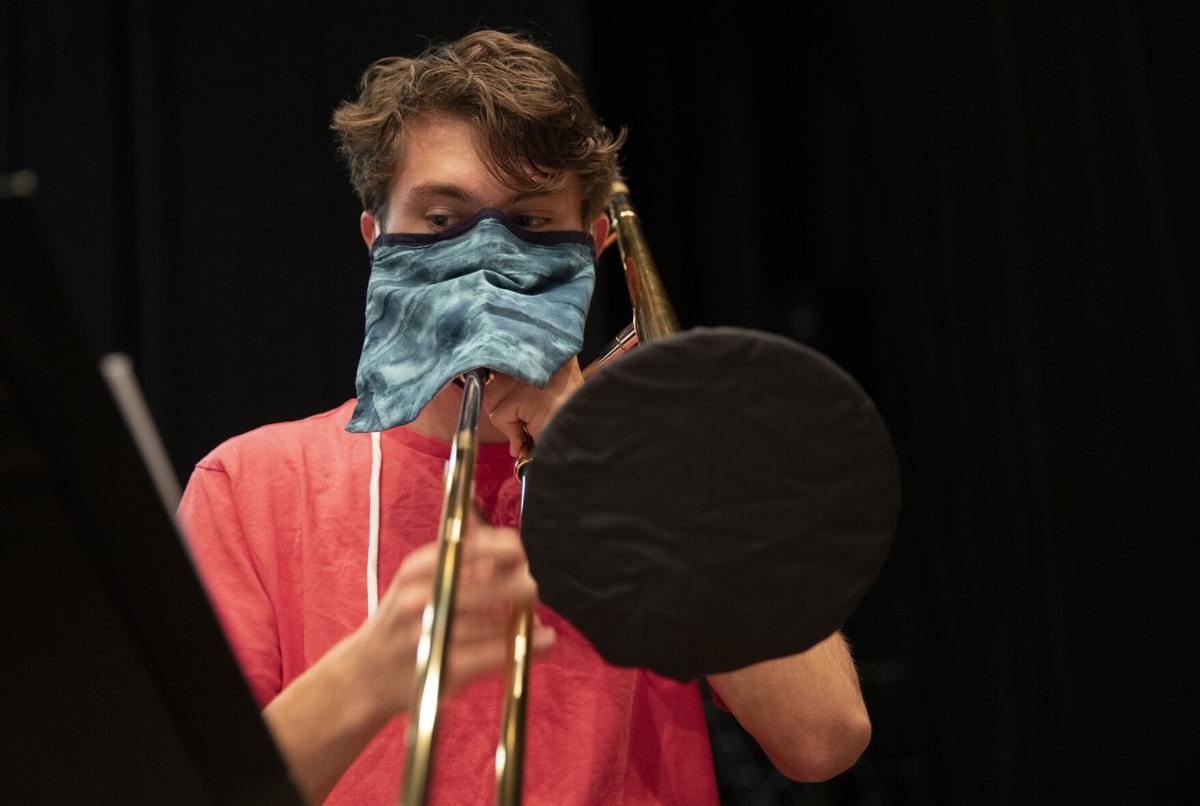 Musicians improvise masks for wind instruments to keep the band ...