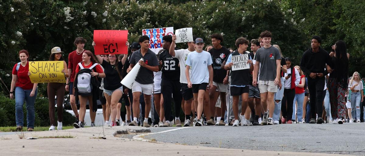 Forsyth County students stage walkout to protest job cuts