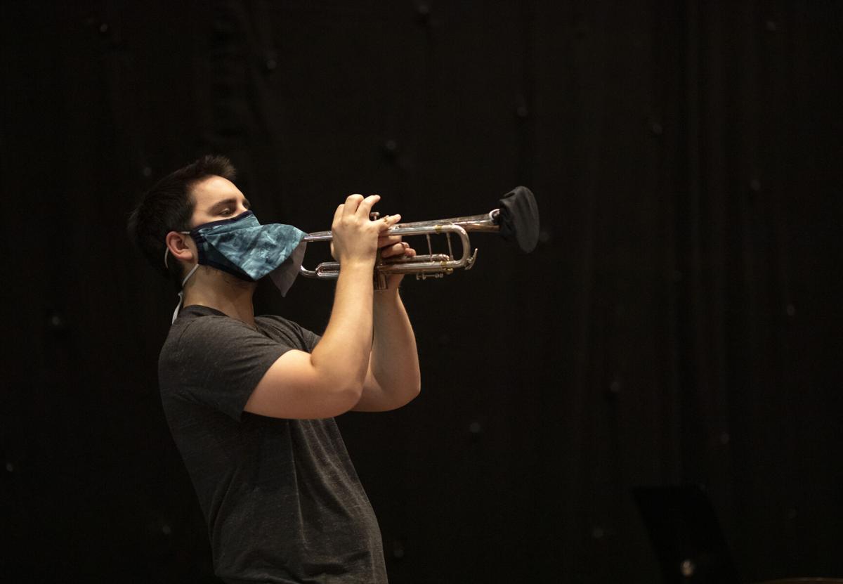 Musicians improvise masks for wind instruments to keep the band ...