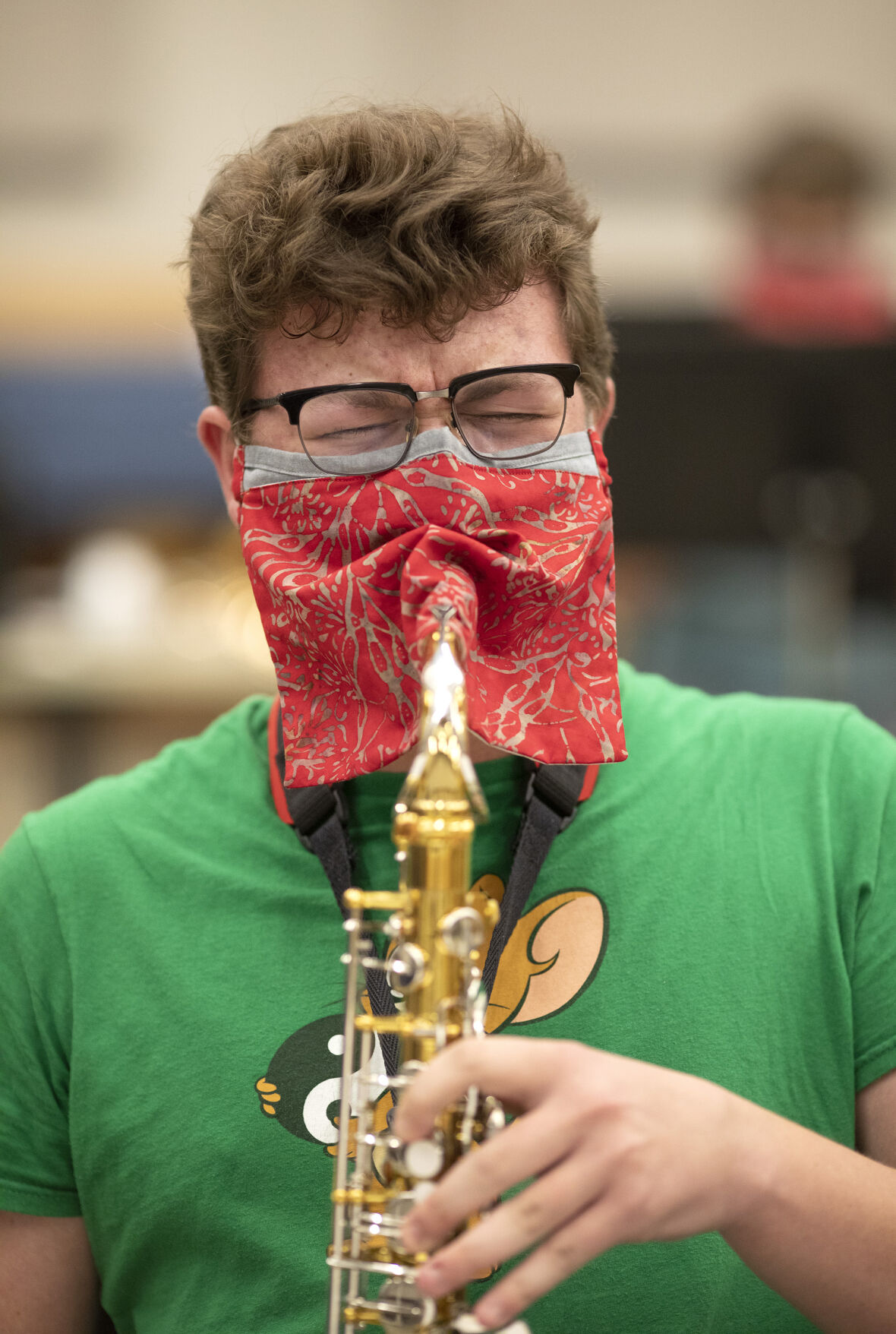 Musicians improvise masks for wind instruments to keep the band ...