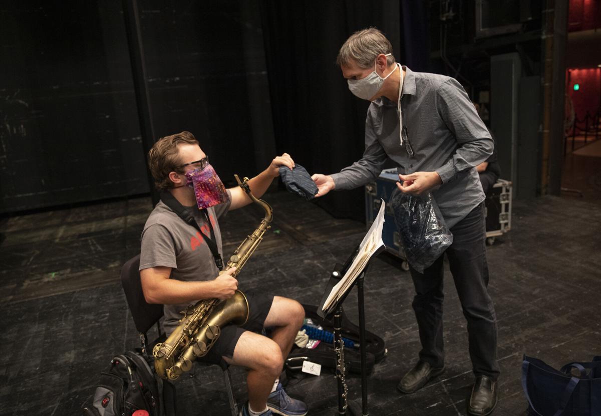 Musicians improvise masks for wind instruments to keep the band ...