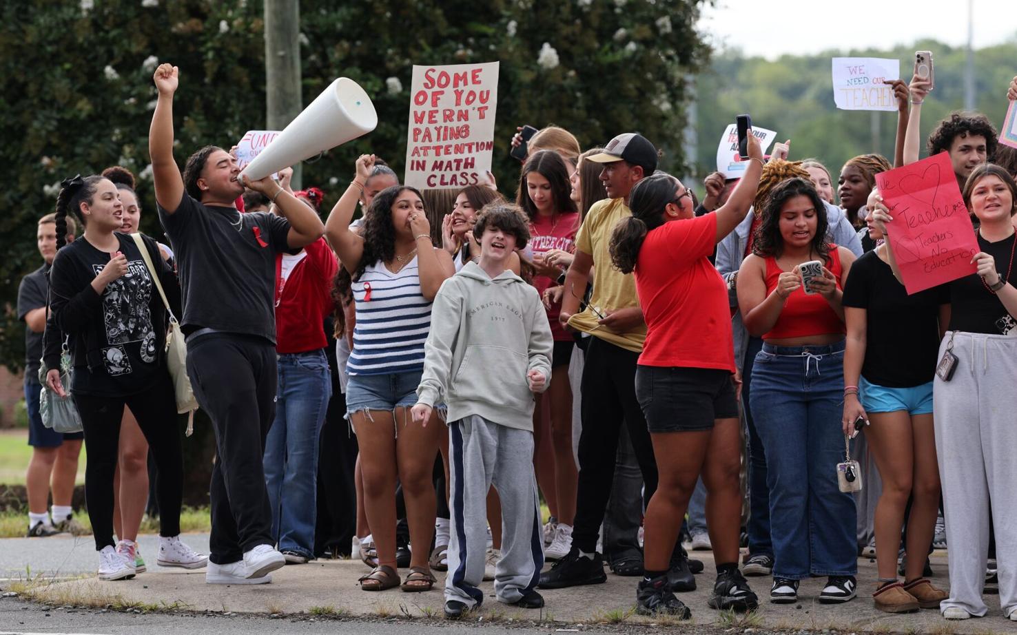 Forsyth County students stage walkout to protest job cuts