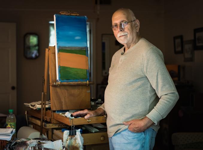 Visual artist William "Huffy" Huffman chose paint brushes over a red ...