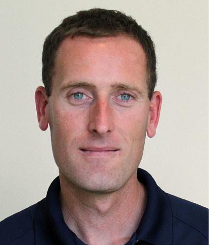 Bishop McGuinness cross-country coach Robert Youtz