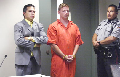Marine charged in wife's death makes first appearance in court