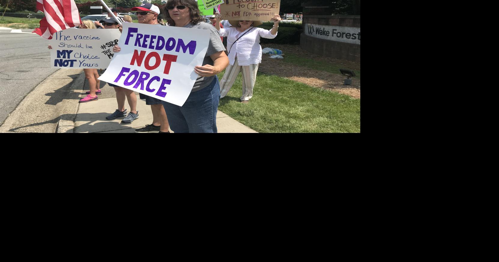 Group protests mandatory hospital worker vaccinations in front of Wake ...