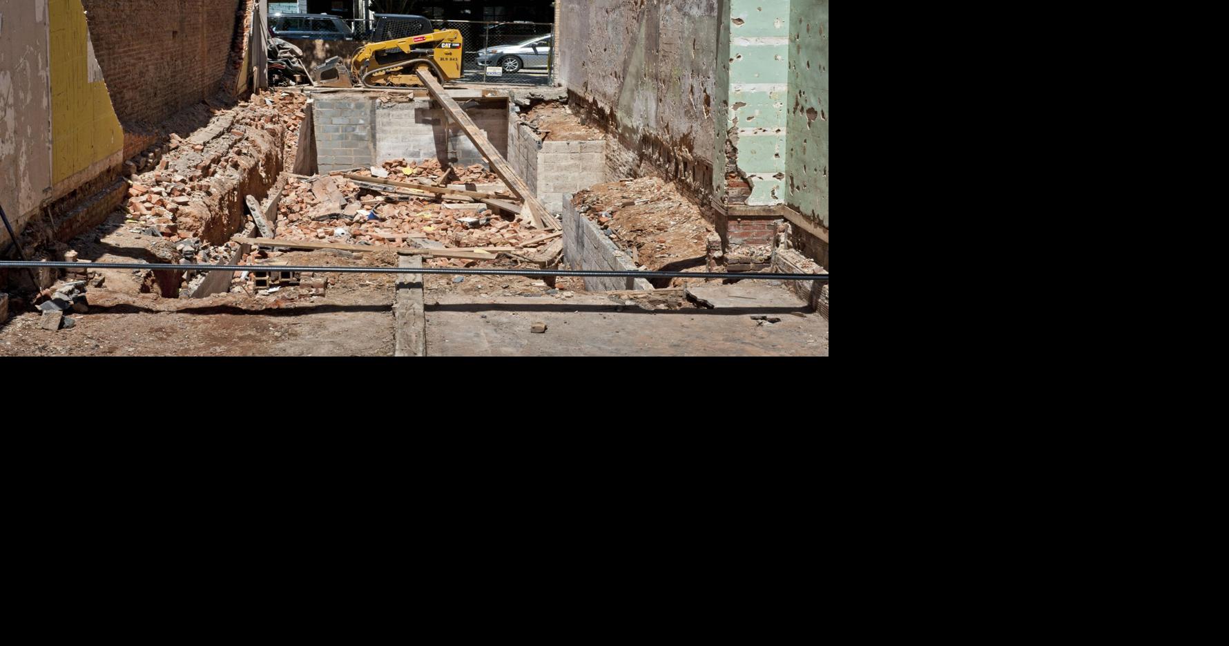 Worker pinned by collapsed brick wall expected to recover; site under ...