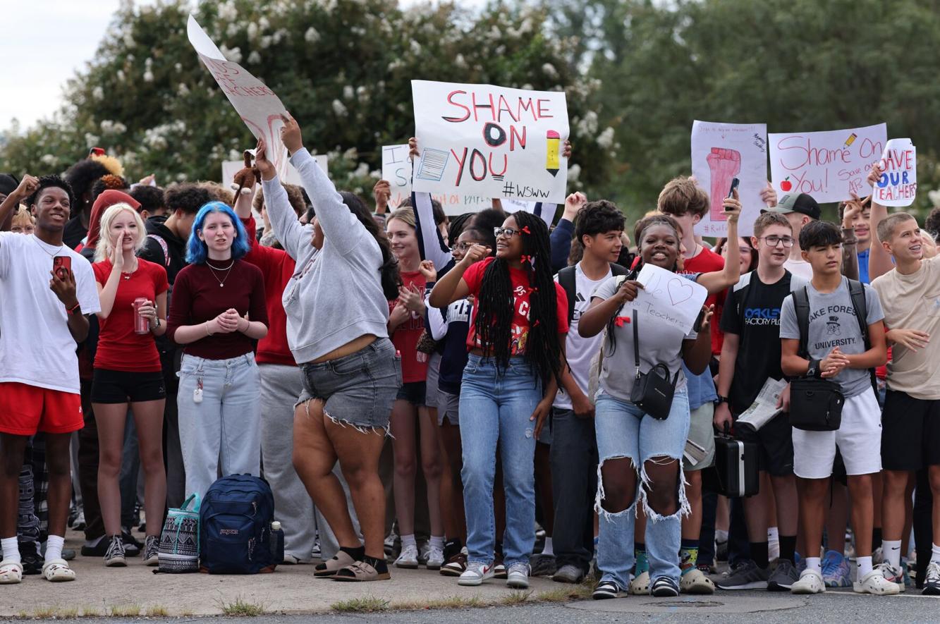 Forsyth County students stage walkout to protest job cuts