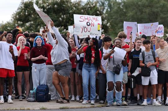 Forsyth County students stage walkout to protest job cuts