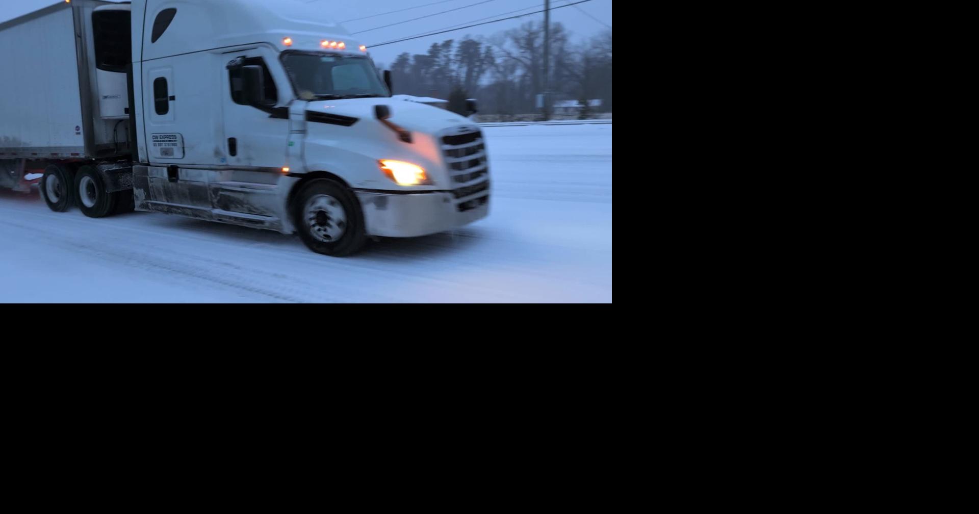 Snow covers West Friendly Avenue near Urban Loop