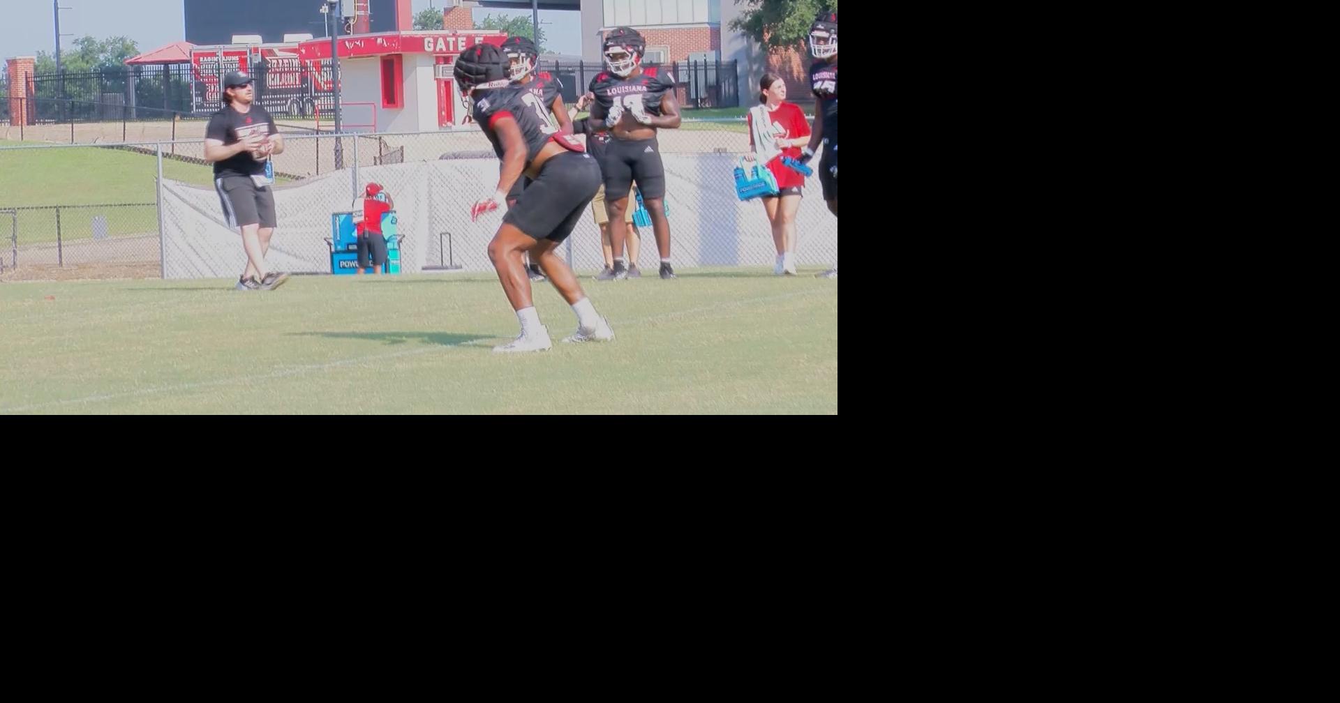 UL football players battle the heat while fighting for positions to ...