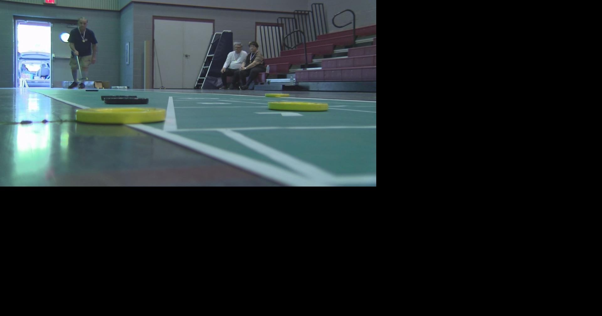 Competitors show off shuffleboard skills during Senior Olympics ...