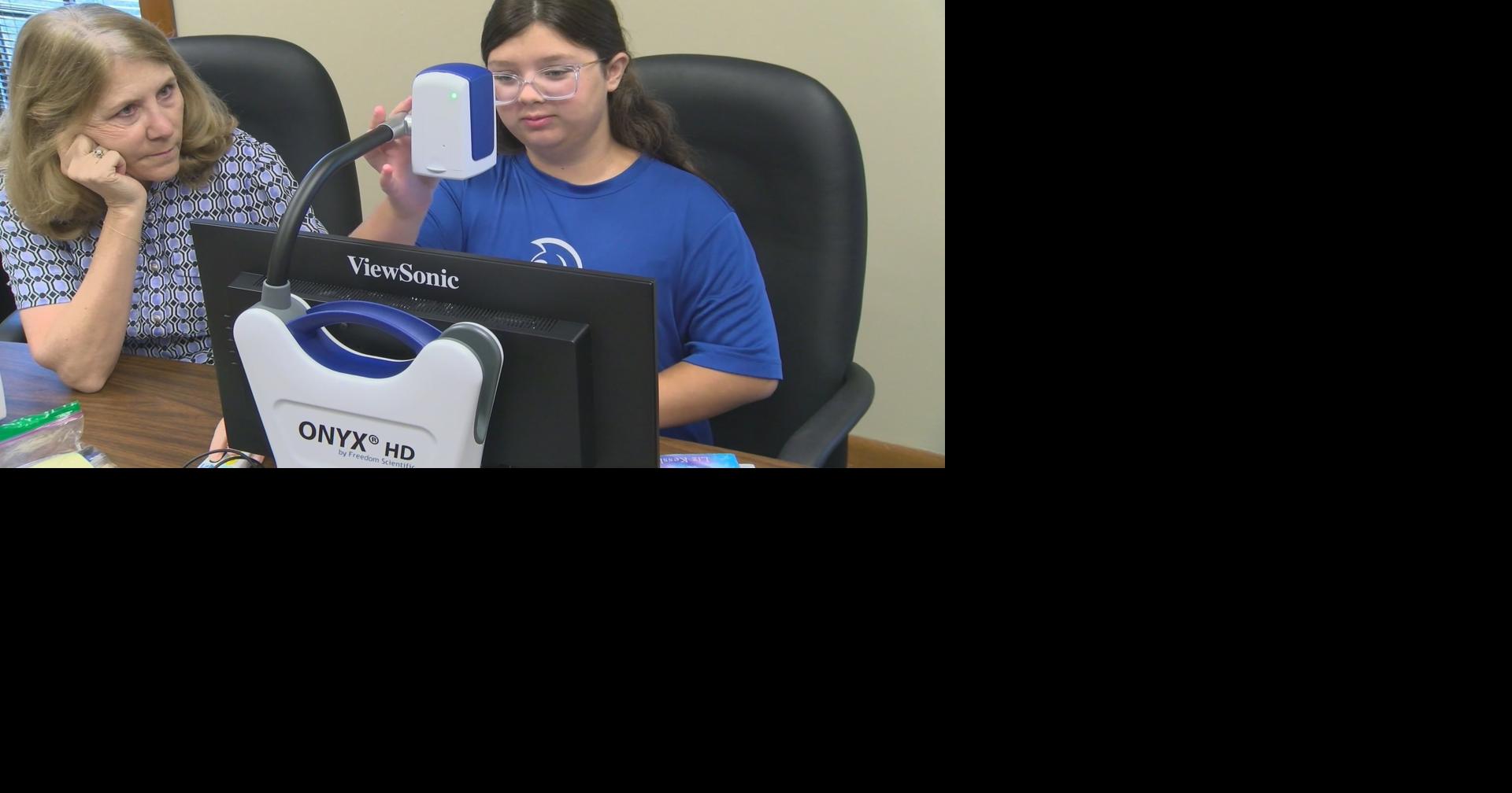 Visually-impaired child receives high-tech aids to help her see better ...