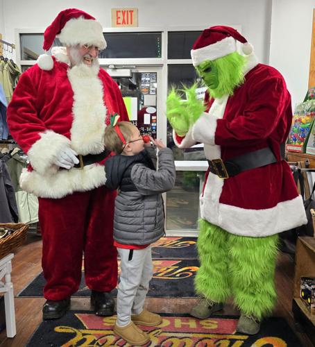 Santa and the Grinch spread holiday cheer through Kane's business ...