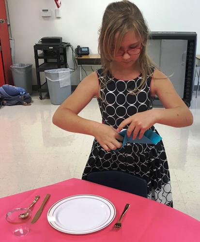Williams/Ledger students learn proper manners during an after-school ...