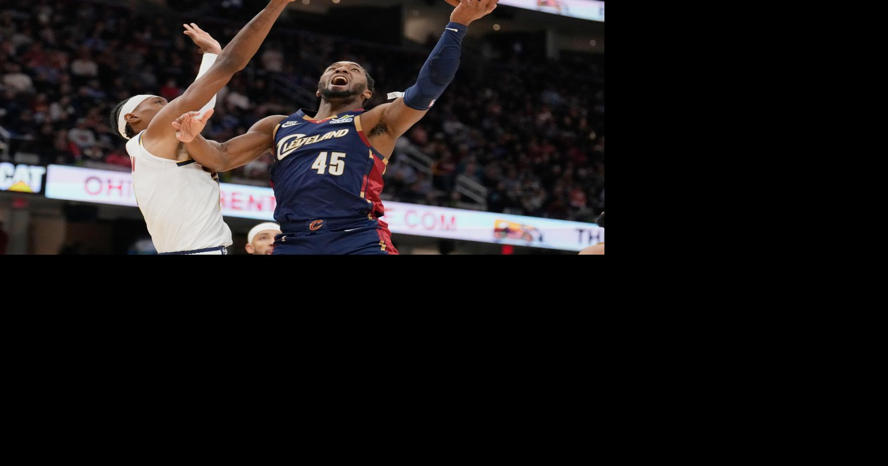 Mitchell's 33 points propel Cavaliers past short-handed Nuggets ...