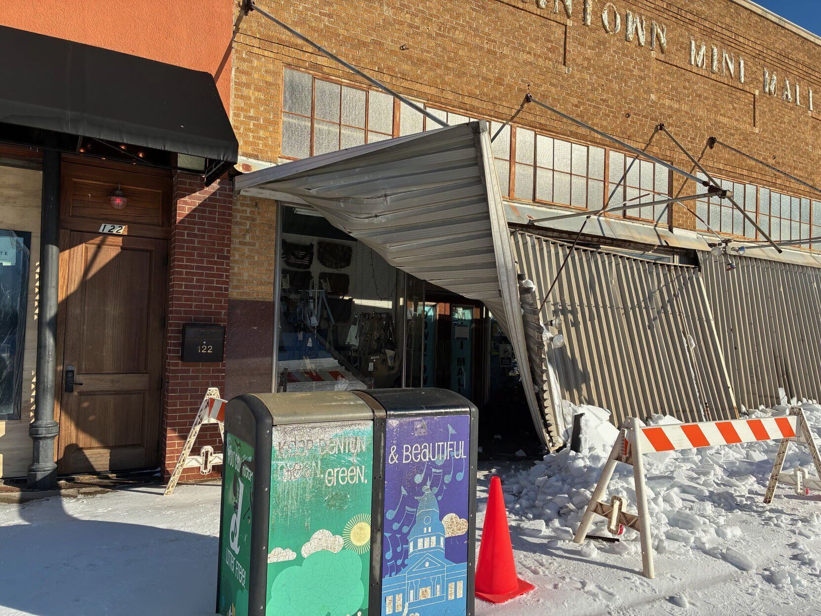 Look: Downtown Mini Mall II awning collapses under ice, sleet | Texas ...