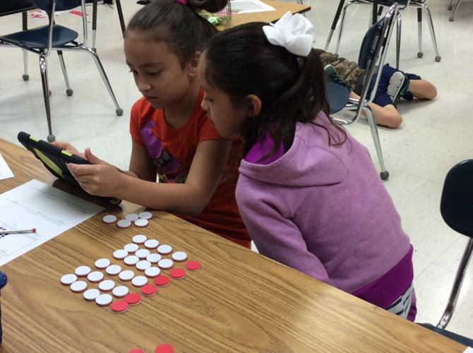 Students multiply learning by building arrays of colored counters ...