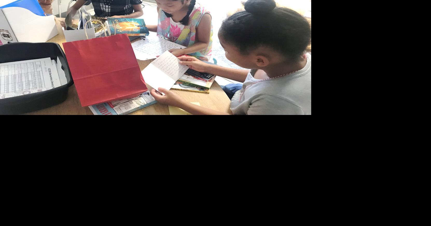 Books from strangers welcome Williams/Ledger students back to school ...
