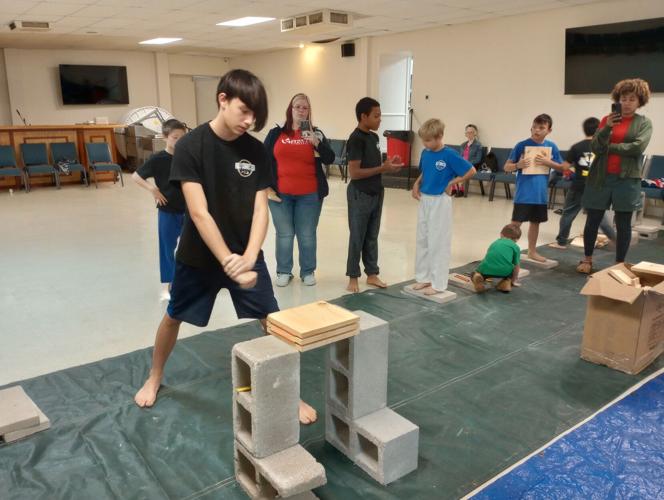 Cove kids learn how to break boards during martial arts demonstration ...