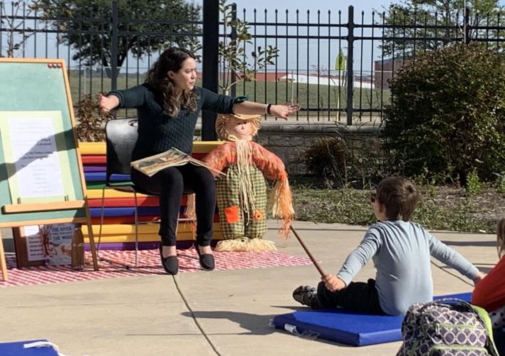 Children enjoy outdoor, in-person storytime at Heights library ...