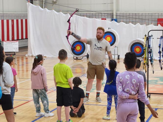 Students of all abilities learn about archery in Heights | Local ...