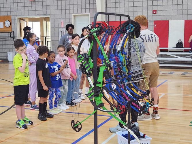 Students of all abilities learn about archery in Heights | Local ...