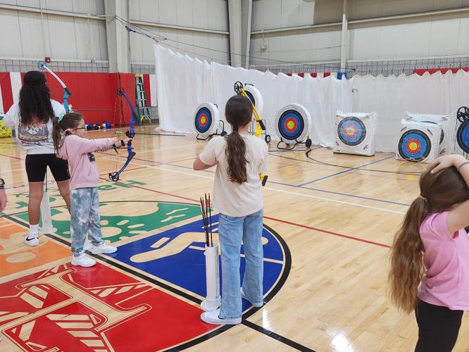 Students of all abilities learn about archery in Heights | Local ...
