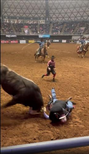 Father protects son after being thrown from a bull at the Belton rodeo ...