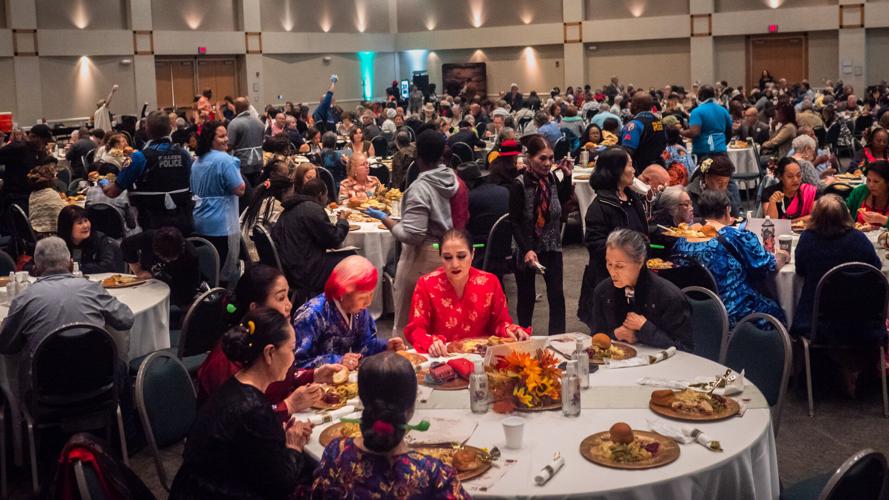 Giving Thanks: City officials dish out early Thanksgiving meal to ...