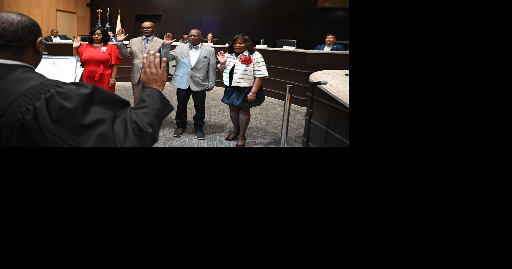 Four council members take the oath of office as election results ...