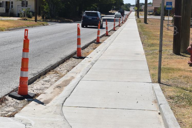 City council awards bid to resume sidewalk project; Suja Lane project ...