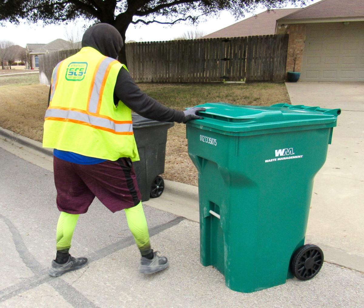 Heights distributes trash carts in preparation for new service | Local ...