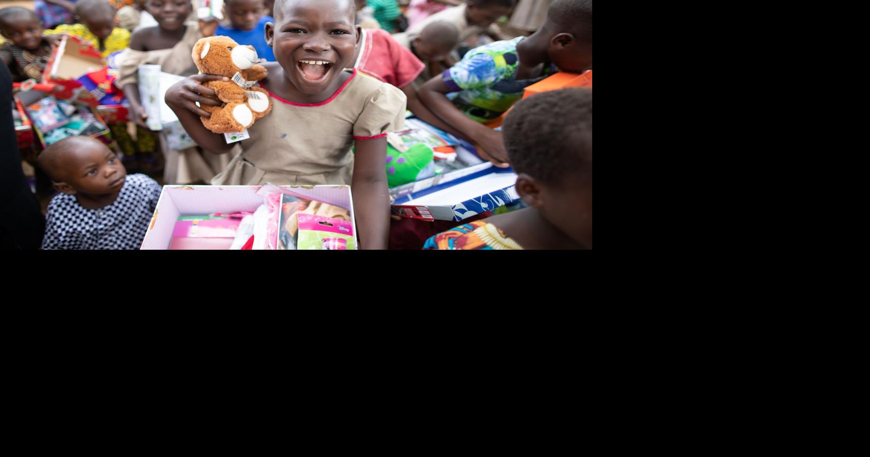 Early packing for Christmas boxes going around the world for children ...