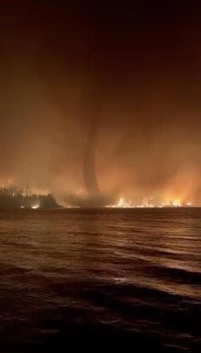 Video captures 'incredibly rare' B.C. wildfire tornado over lake ...