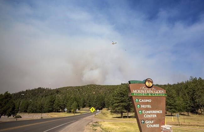 At least 1 dead in New Mexico wildfire that forced thousands to flee ...