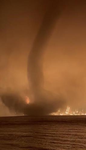 Video captures 'incredibly rare' B.C. wildfire tornado over lake ...