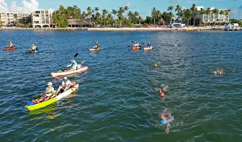 SEEING THE LIGHT: More than 300 swimmers compete in Florida Keys open ...