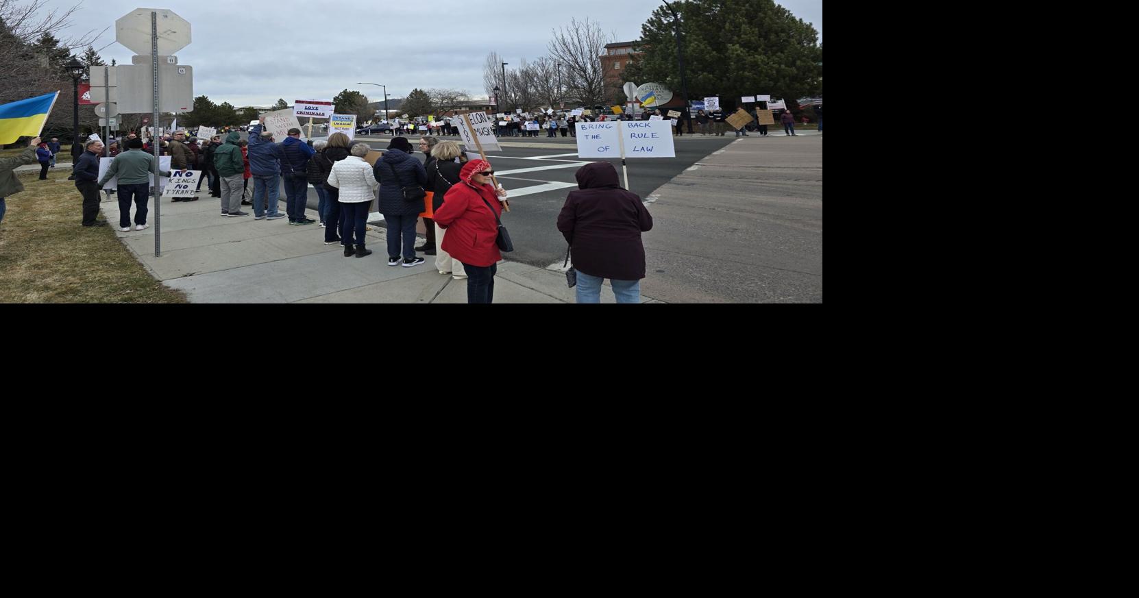 Protesters rally outside Rep. Michael Baumgartner's Spokane office ...