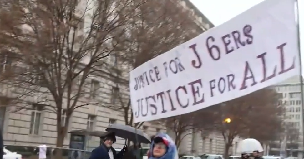 Protestors gather outside of the Justice Department, exactly 3 years ...